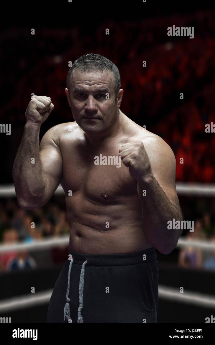 professional kickboxer with hands in martial arts position training for ...