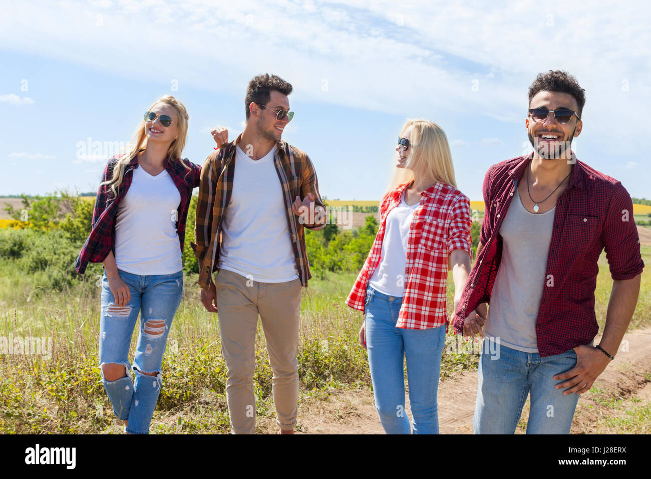 People group friends walking countryside road two couple happy smile ...