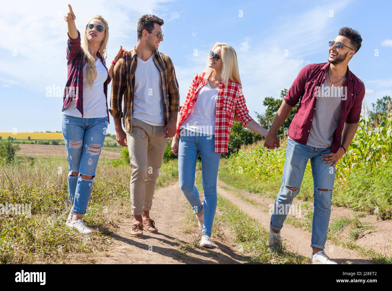 People group friends walking countryside road two couple happy smile ...