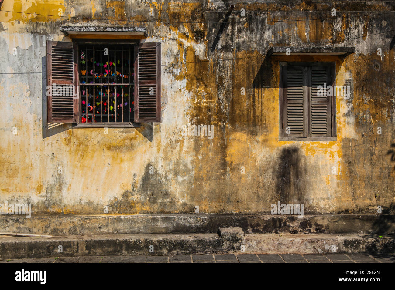 Textured wall of building in Hoi An, Vietnam Stock Photo - Alamy