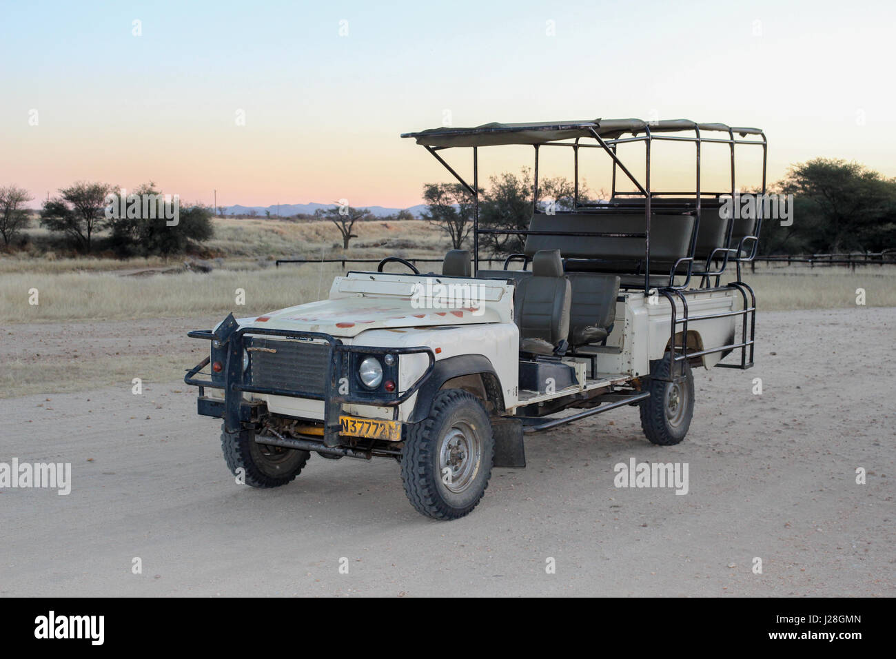 Namibia, Okapuka Ranch, Safari, Game Drive, Safari Jeep in the sunset ...