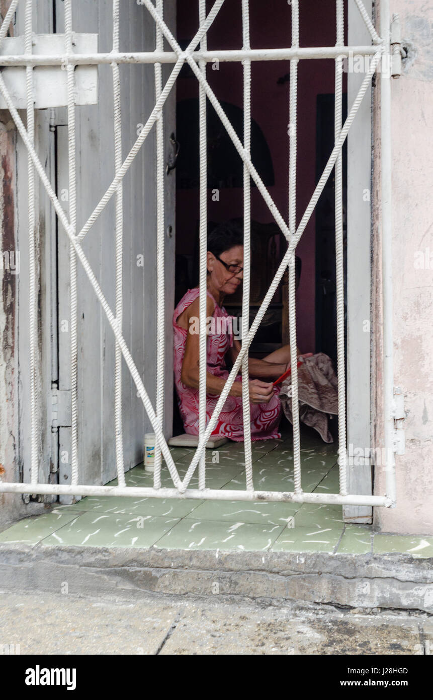 Cuba, Havana, woman sitting at an open door Havana Stock Photo - Alamy