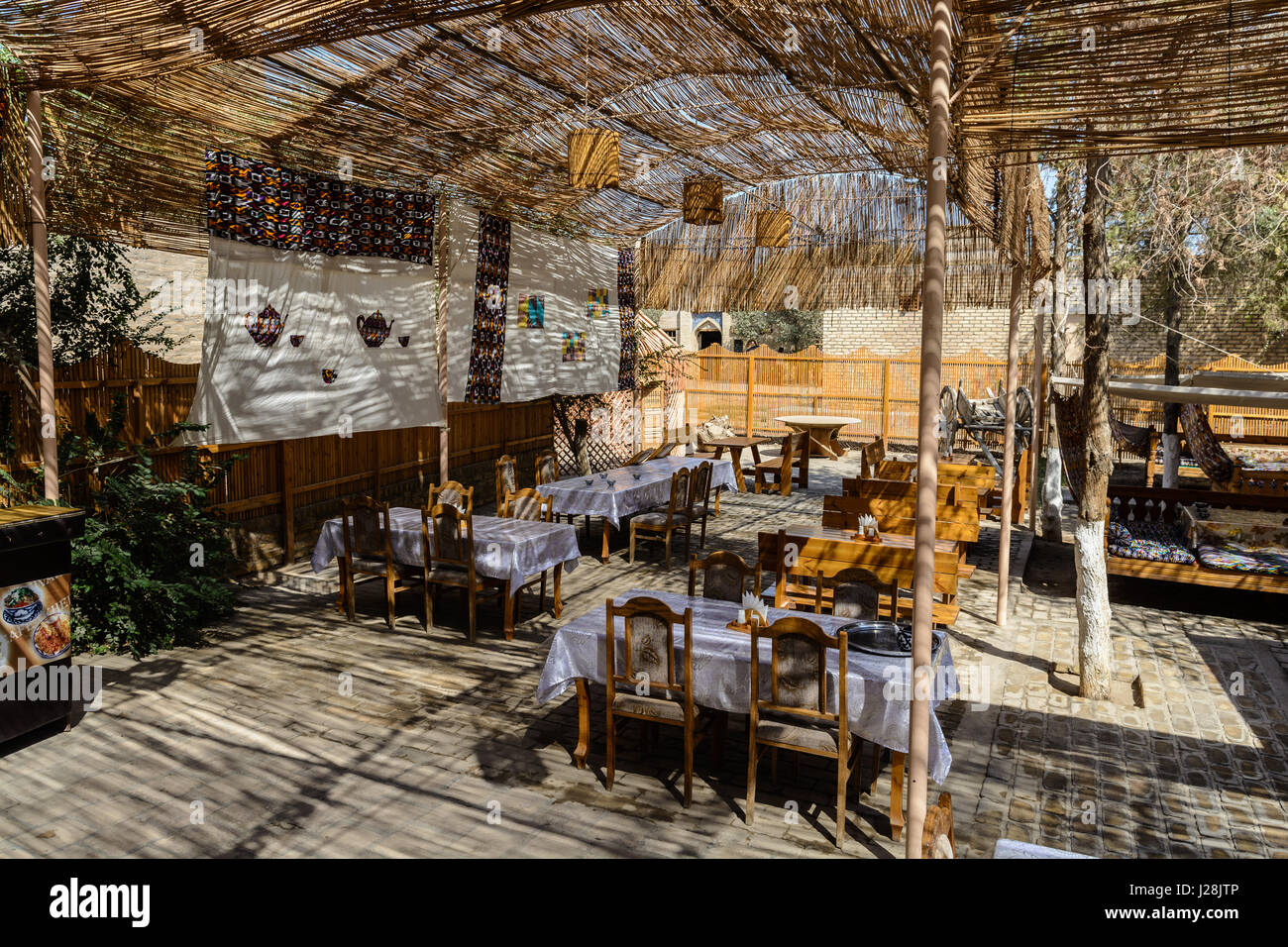 Uzbekistan, Xorazm Province, Xiva, outdoor restaurant Stock Photo - Alamy
