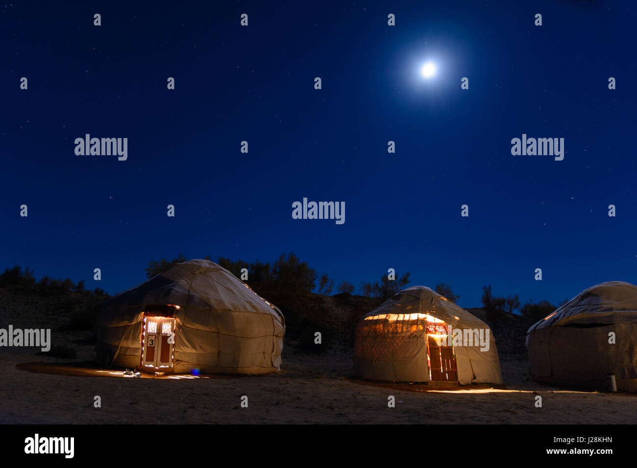 Uzbekistan, Nurota tumani, yurts for tourists at night in the Kizilkum ...
