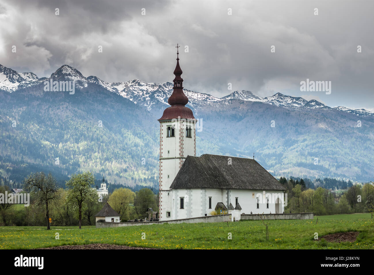 catholic church in field among Alps Stock Photo - Alamy