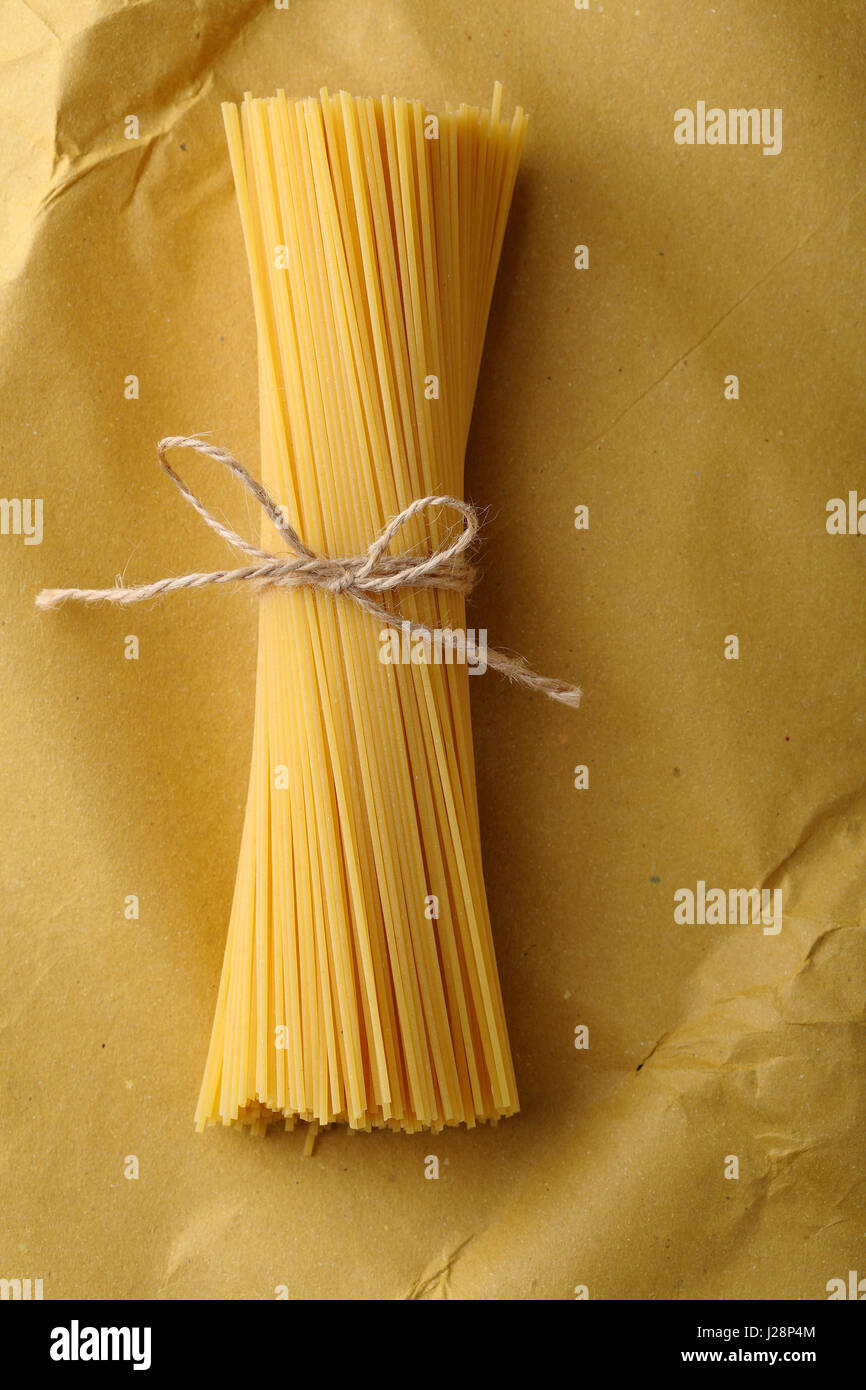Italian pasta top view on paper, food Stock Photo - Alamy