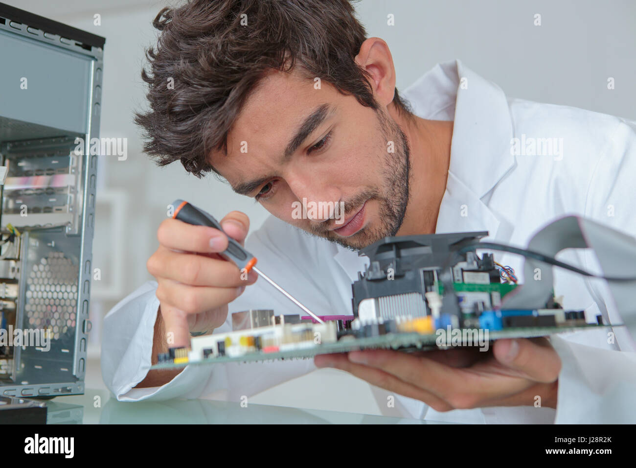 Man working on computer Stock Photo - Alamy