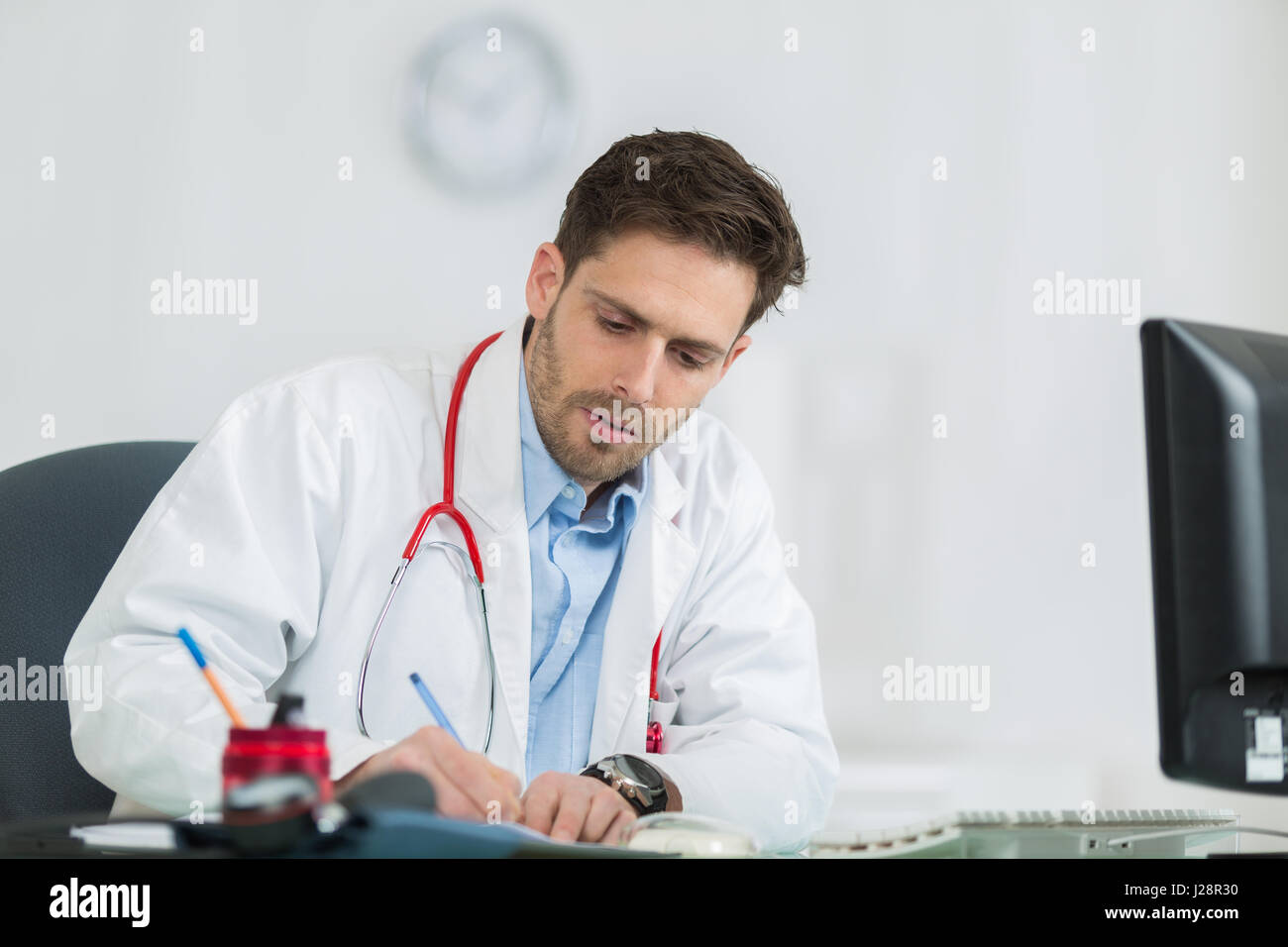 doctor using his computer Stock Photo - Alamy