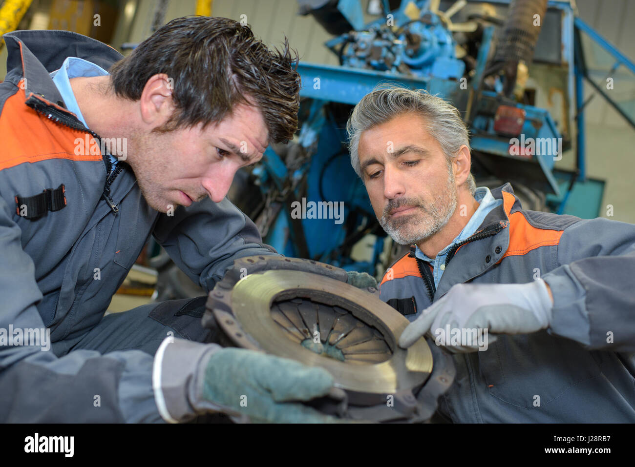 Helping a colleague hi-res stock photography and images - Alamy