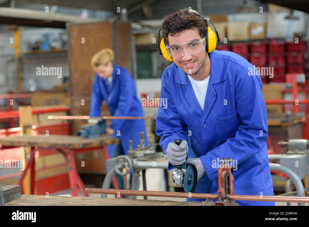 industrial worker wearing earmuffs and goggles Stock Photo - Alamy