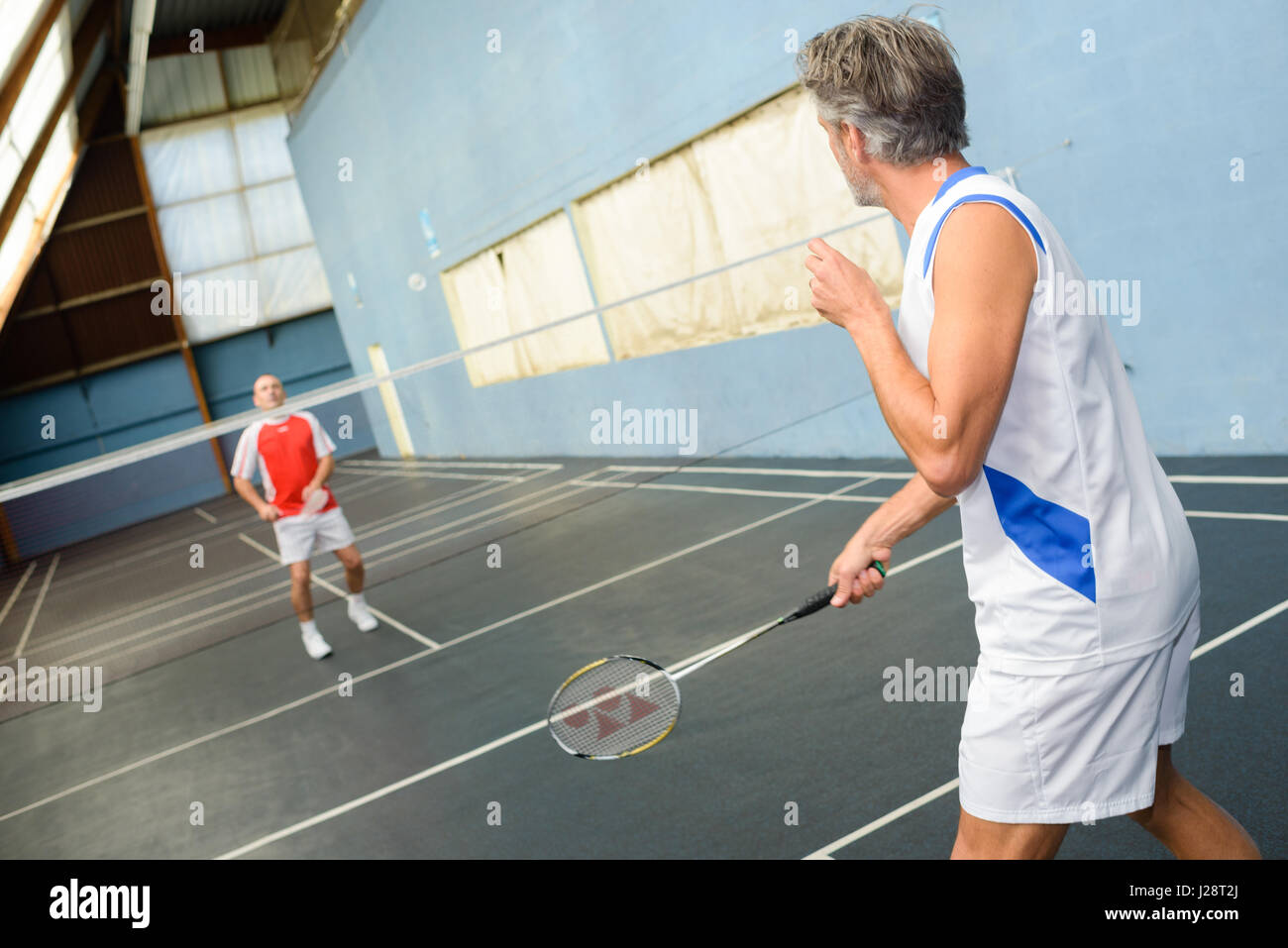 Men playing badminton Stock Photo - Alamy