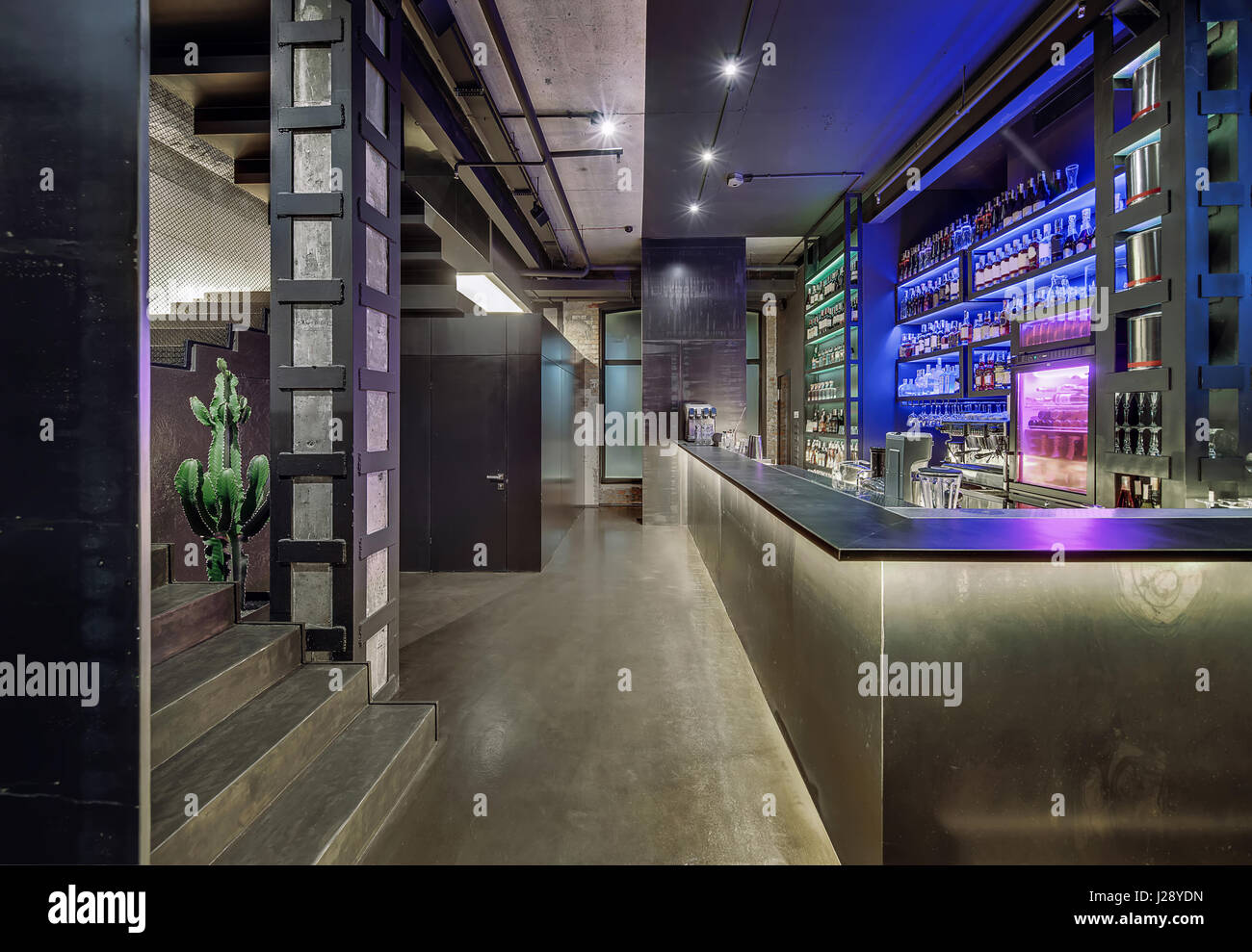 Luminous restaurant in a loft style with brick and concrete walls ...