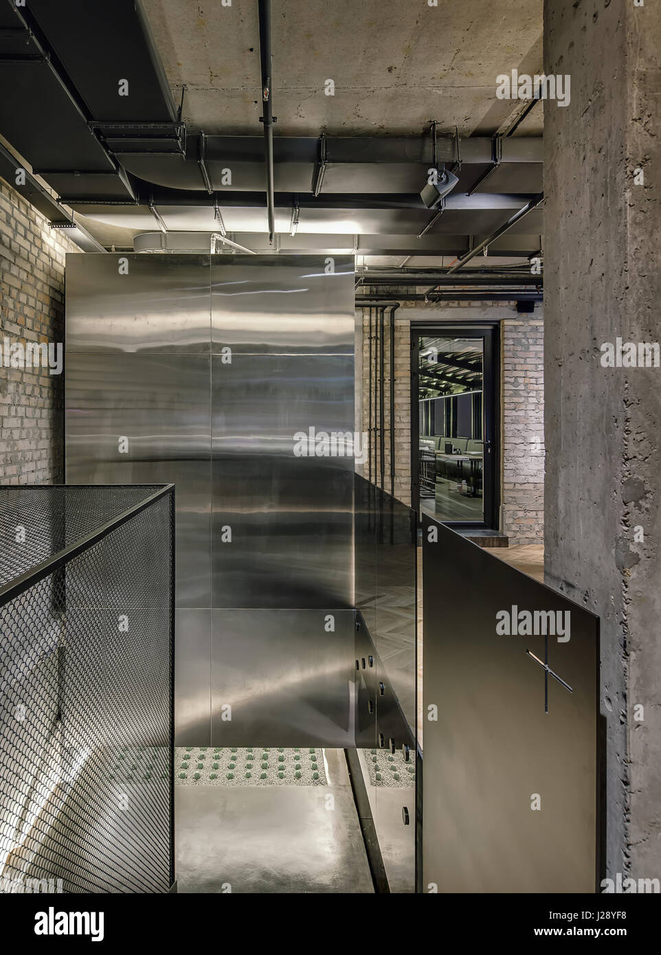 Glowing interior in a cafe in a loft style with brick and concrete ...