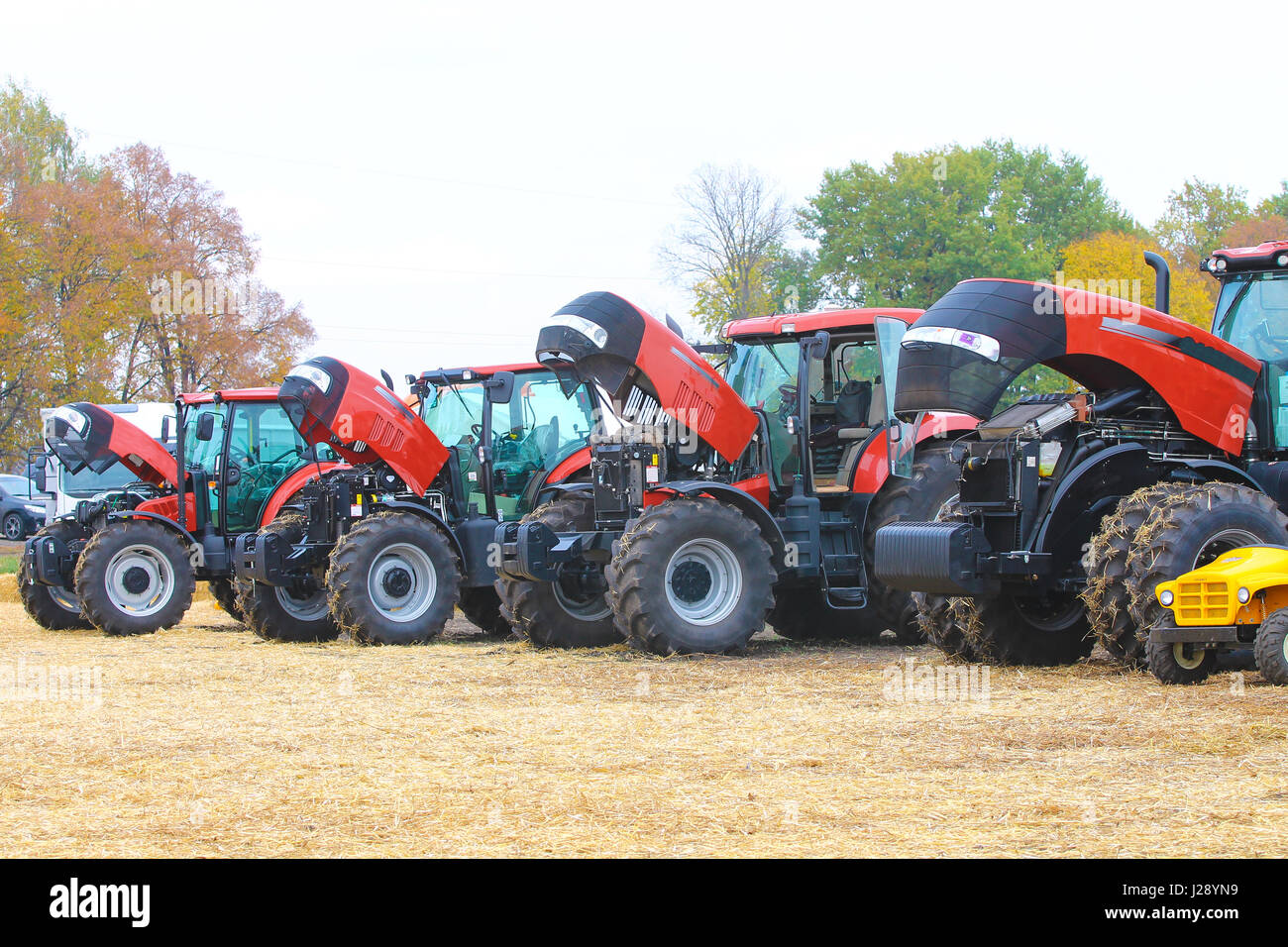 Agricultural machinery. Tractor, standing in a row Stock Photo - Alamy