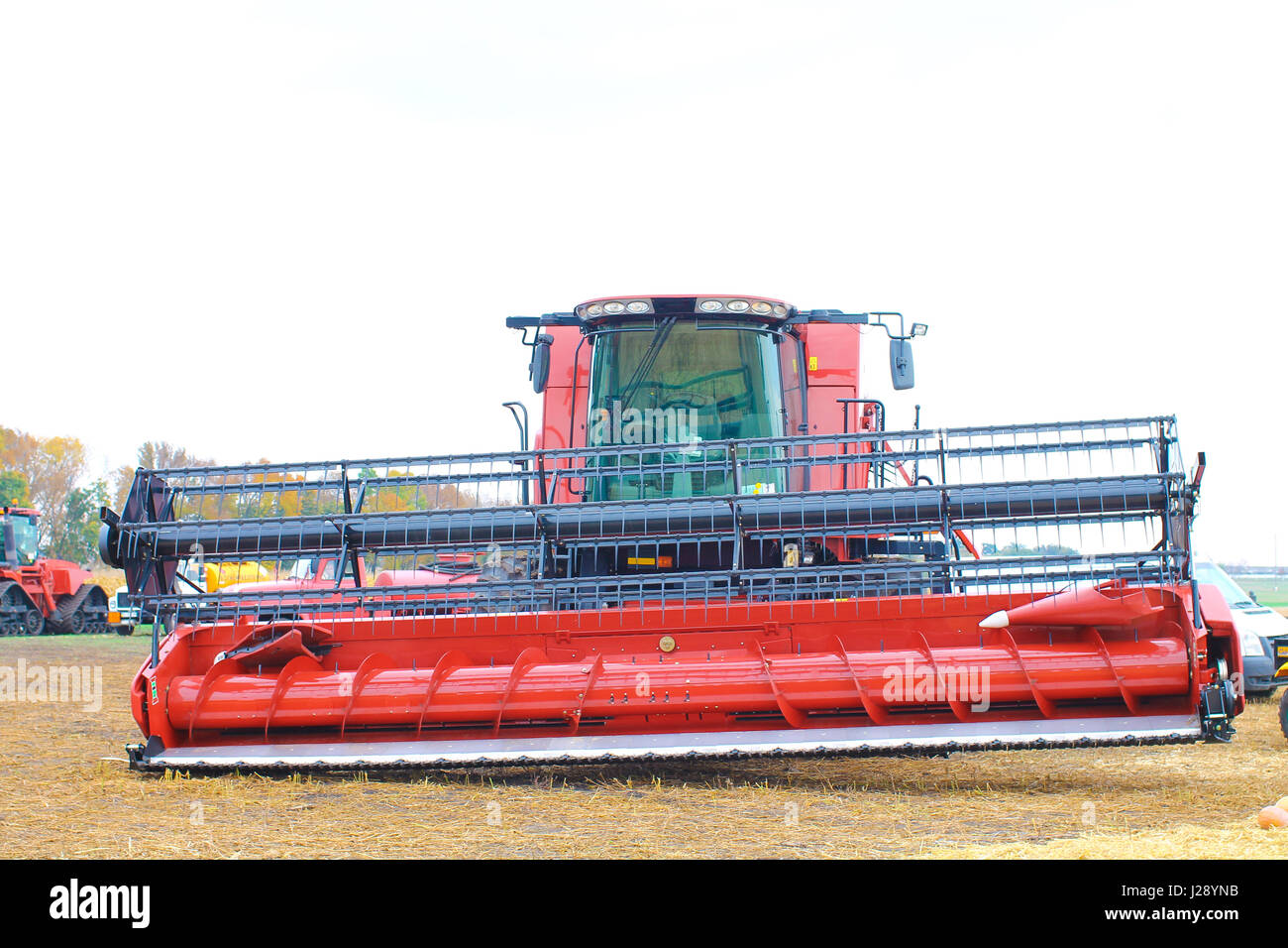 Agricultural machinery. Tractor, standing in a row Stock Photo - Alamy