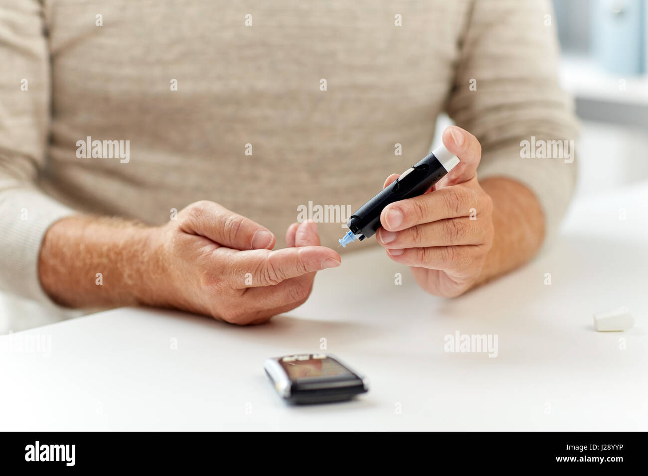 Elderly blood glucose test hi-res stock photography and images - Alamy