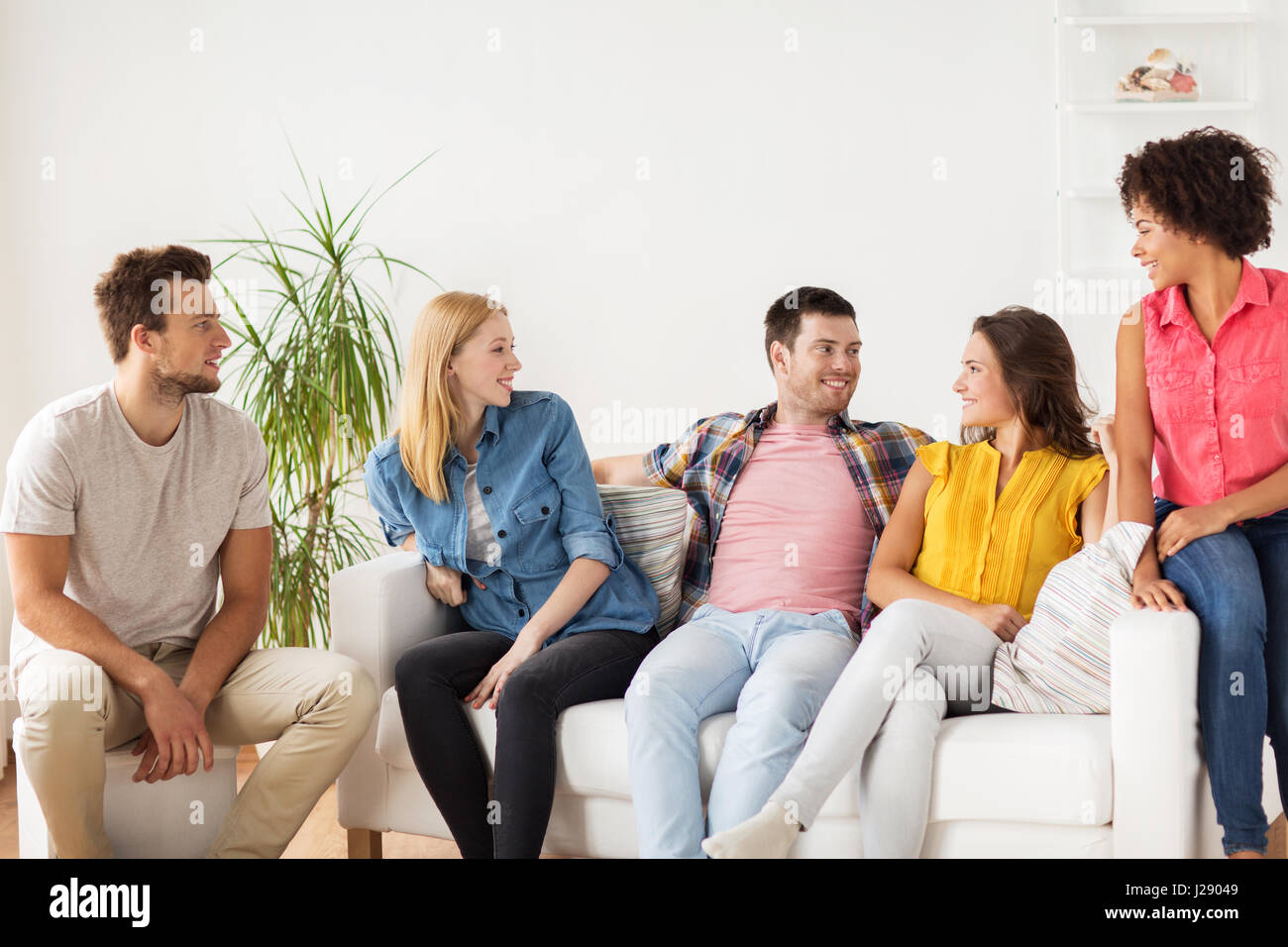 group of happy friends talking at home Stock Photo - Alamy