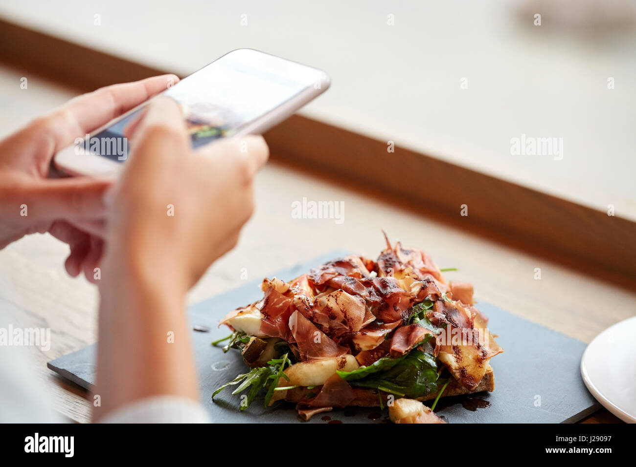 hands with smartphone photographing food Stock Photo - Alamy