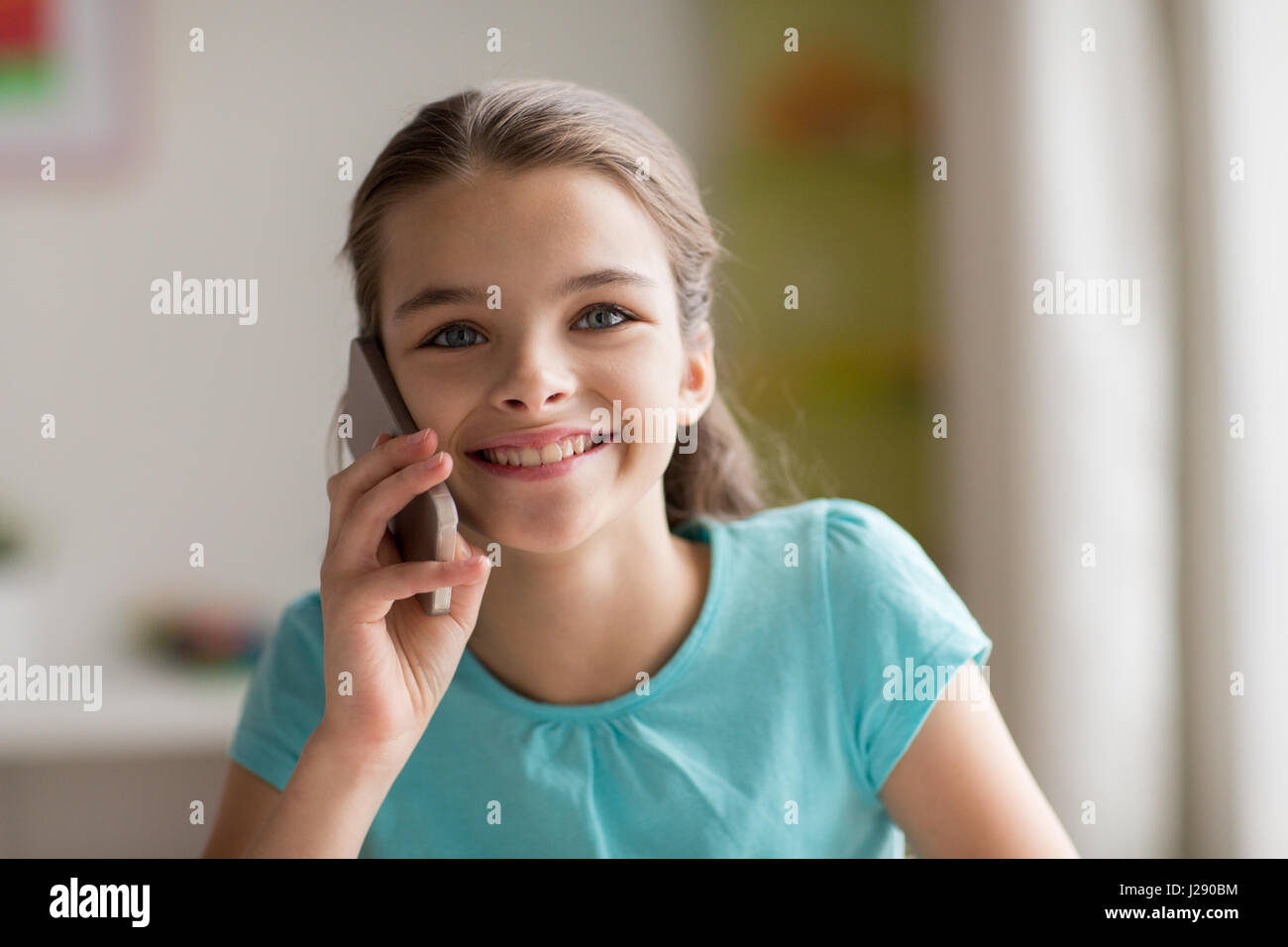 close up of girl calling on smartphone at home Stock Photo - Alamy