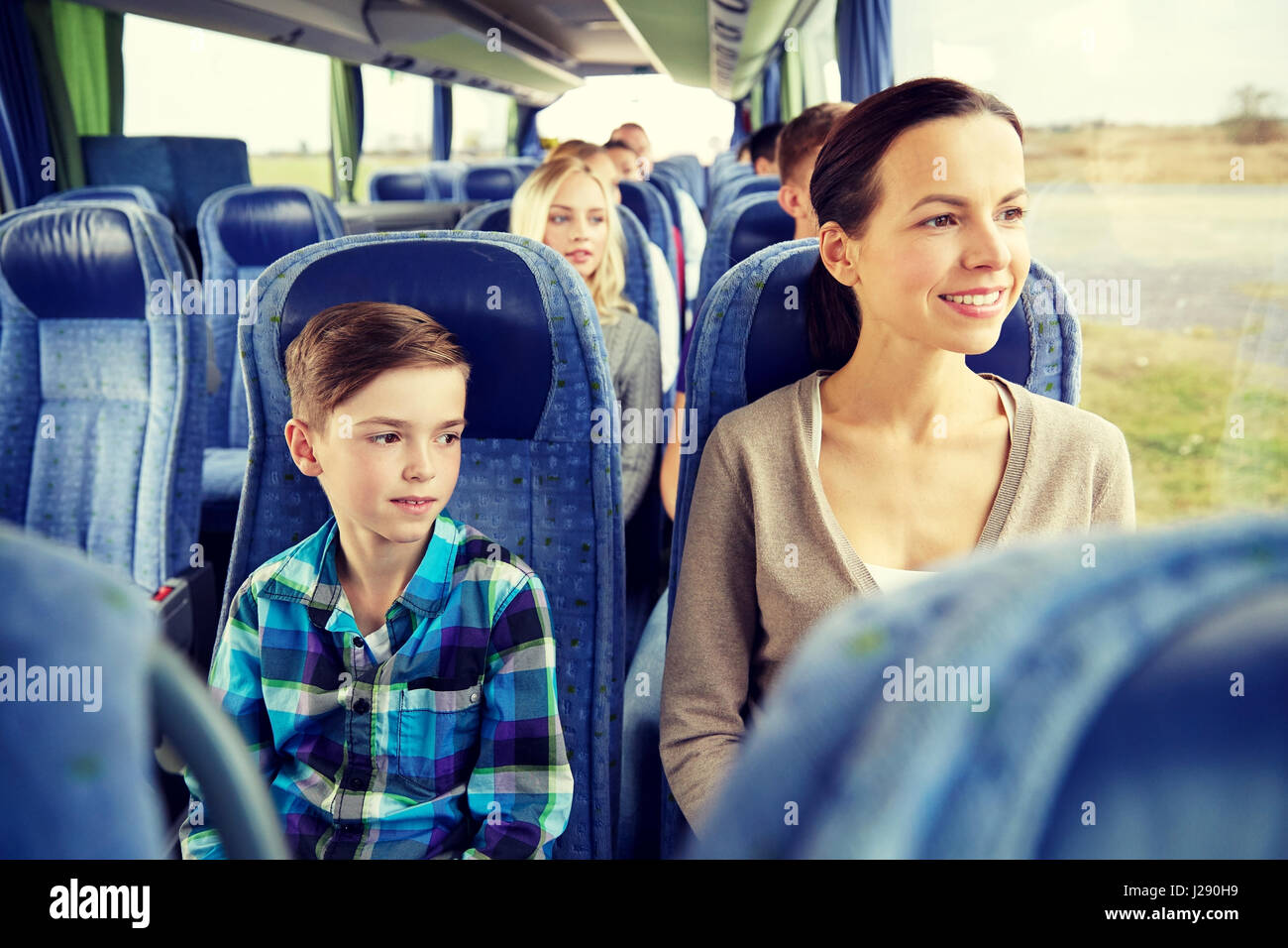 happy family riding in travel bus Stock Photo - Alamy
