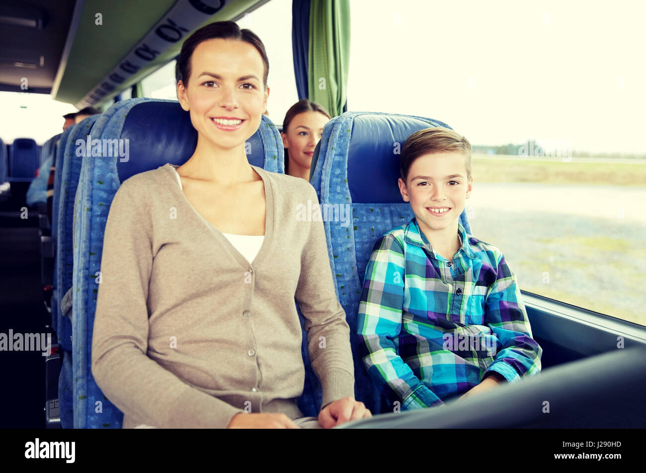 happy family riding in travel bus Stock Photo - Alamy