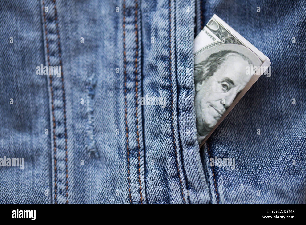 Cash in denim jacket hi-res stock photography and images - Alamy