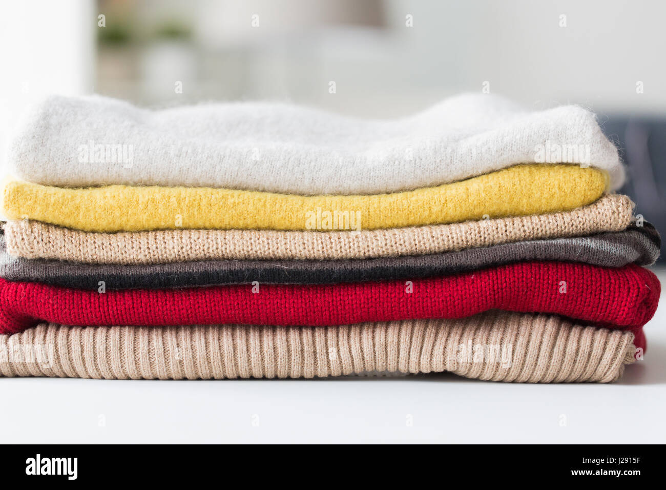 close up of stacked knitted clothes Stock Photo - Alamy