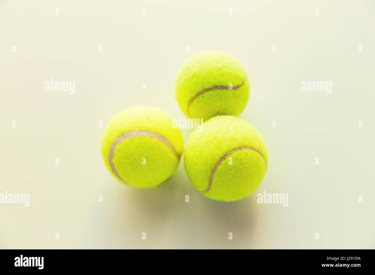 Three yellow tennis balls hi-res stock photography and images - Alamy