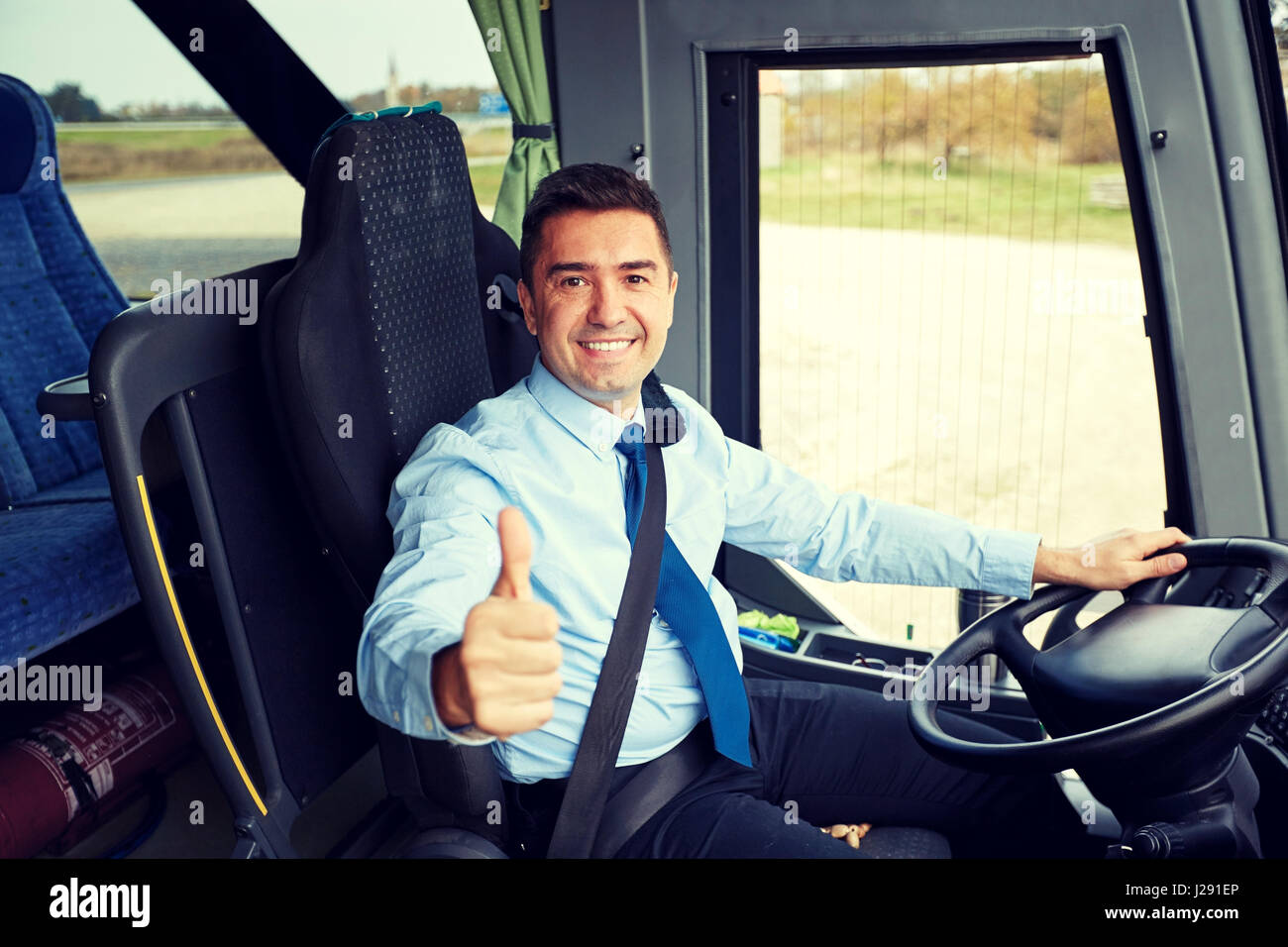Smiling bus driver showing thumbs hi-res stock photography and images ...