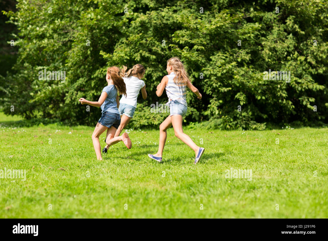 group of happy kids or friends playing outdoors Stock Photo - Alamy