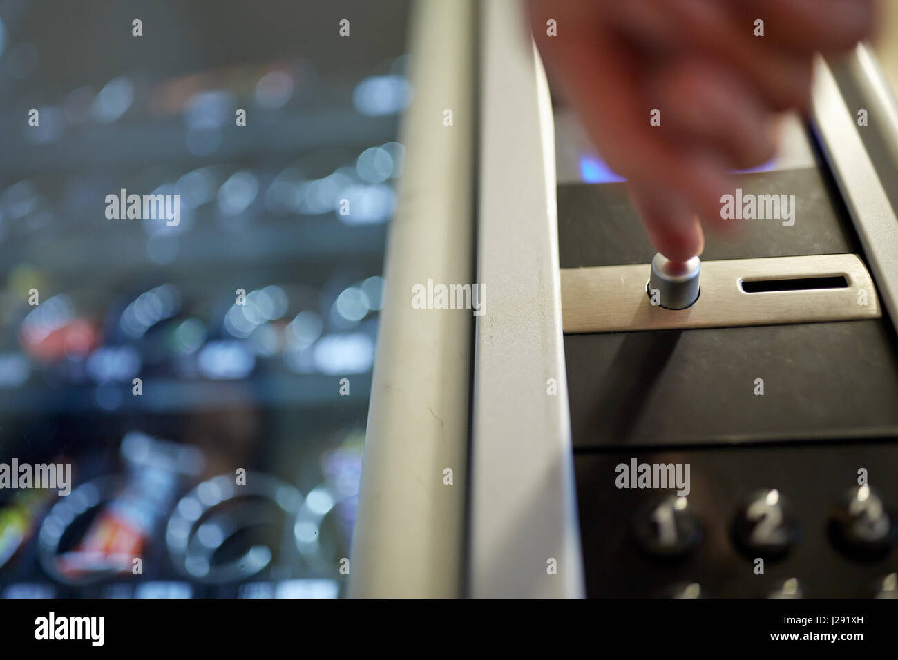 hand pushing button on vending machine Stock Photo - Alamy