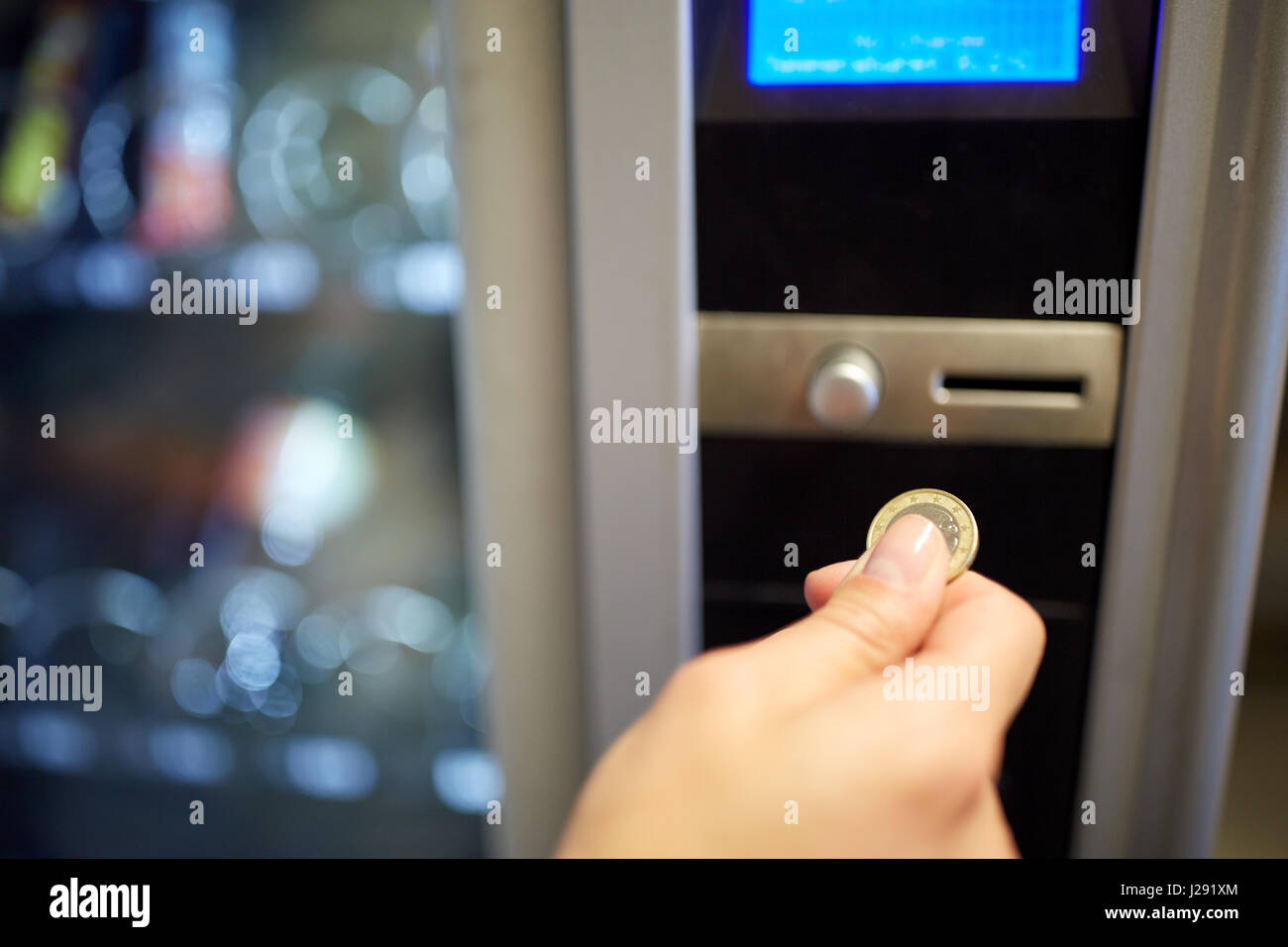 hand inserting euro coin to vending machine slot Stock Photo - Alamy