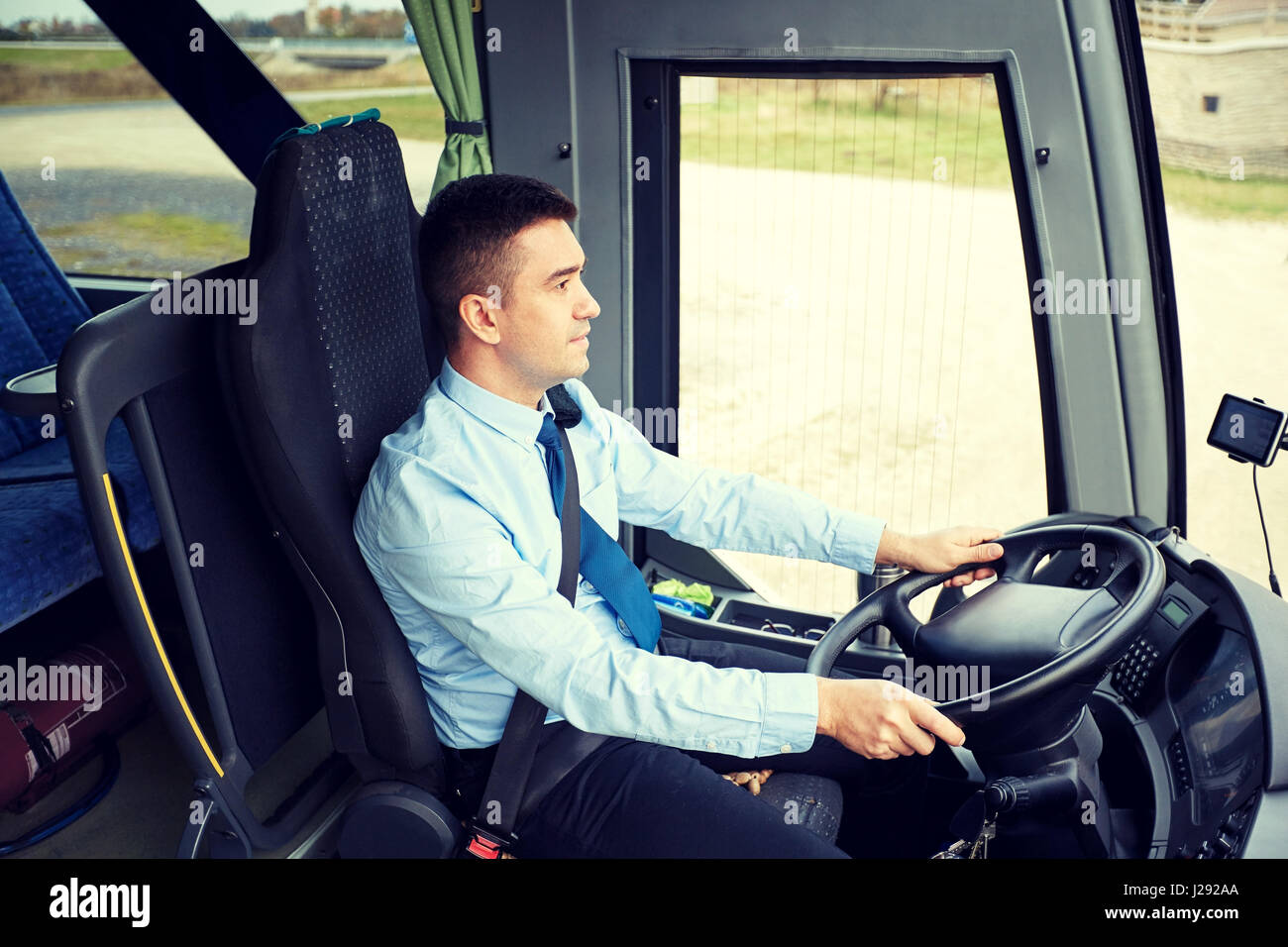 happy driver driving intercity bus Stock Photo - Alamy