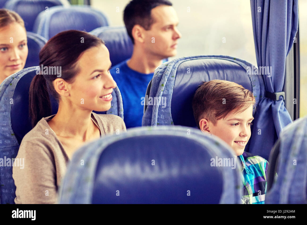 happy family riding in travel bus Stock Photo - Alamy