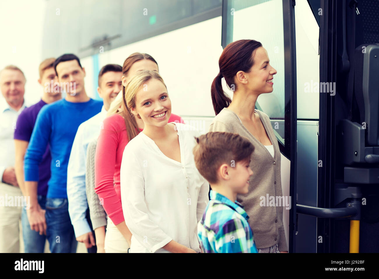 People line boarding bus hi-res stock photography and images - Alamy