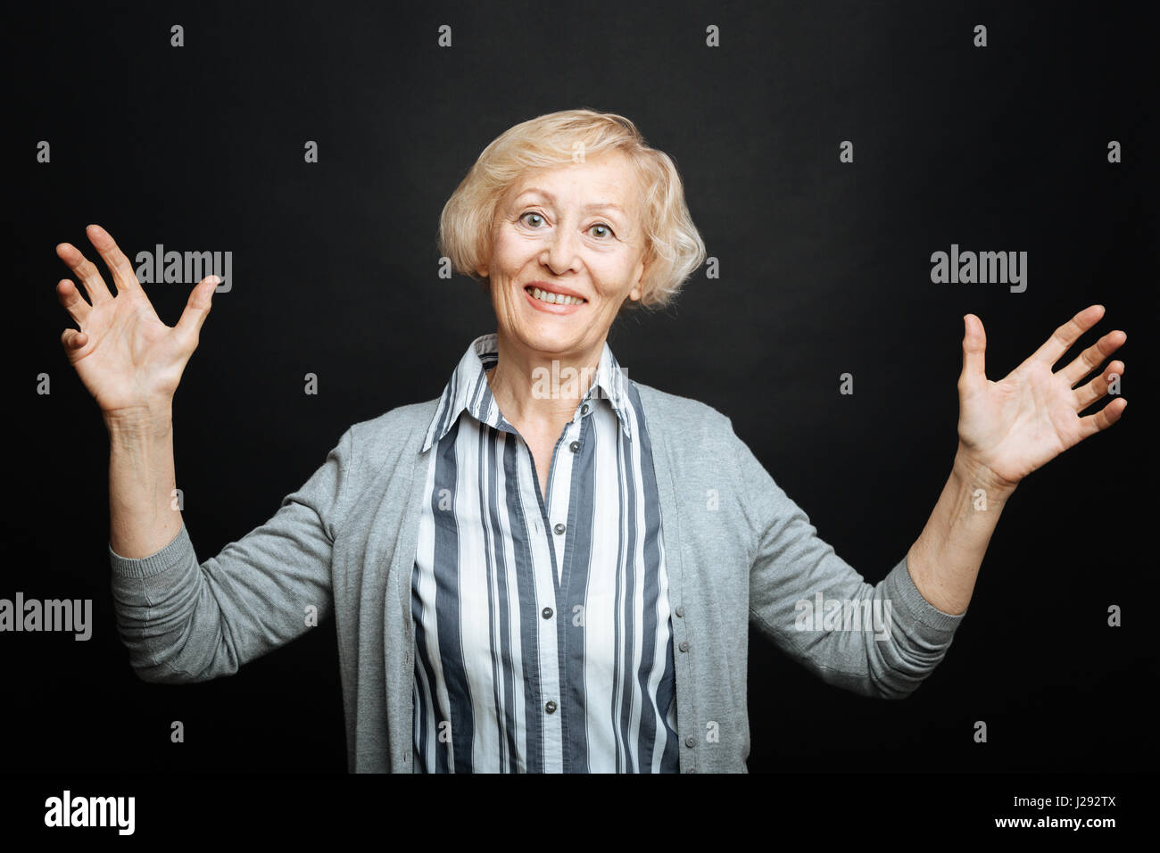 Delighted old woman expressing emotions in the studio Stock Photo - Alamy