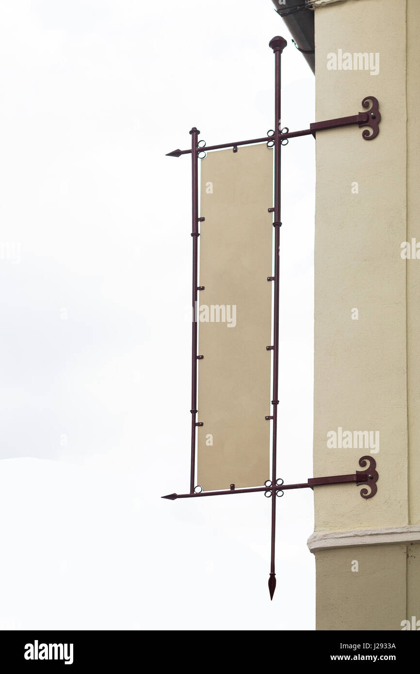 vertical front view of empty square signage with metallic frame on a ...