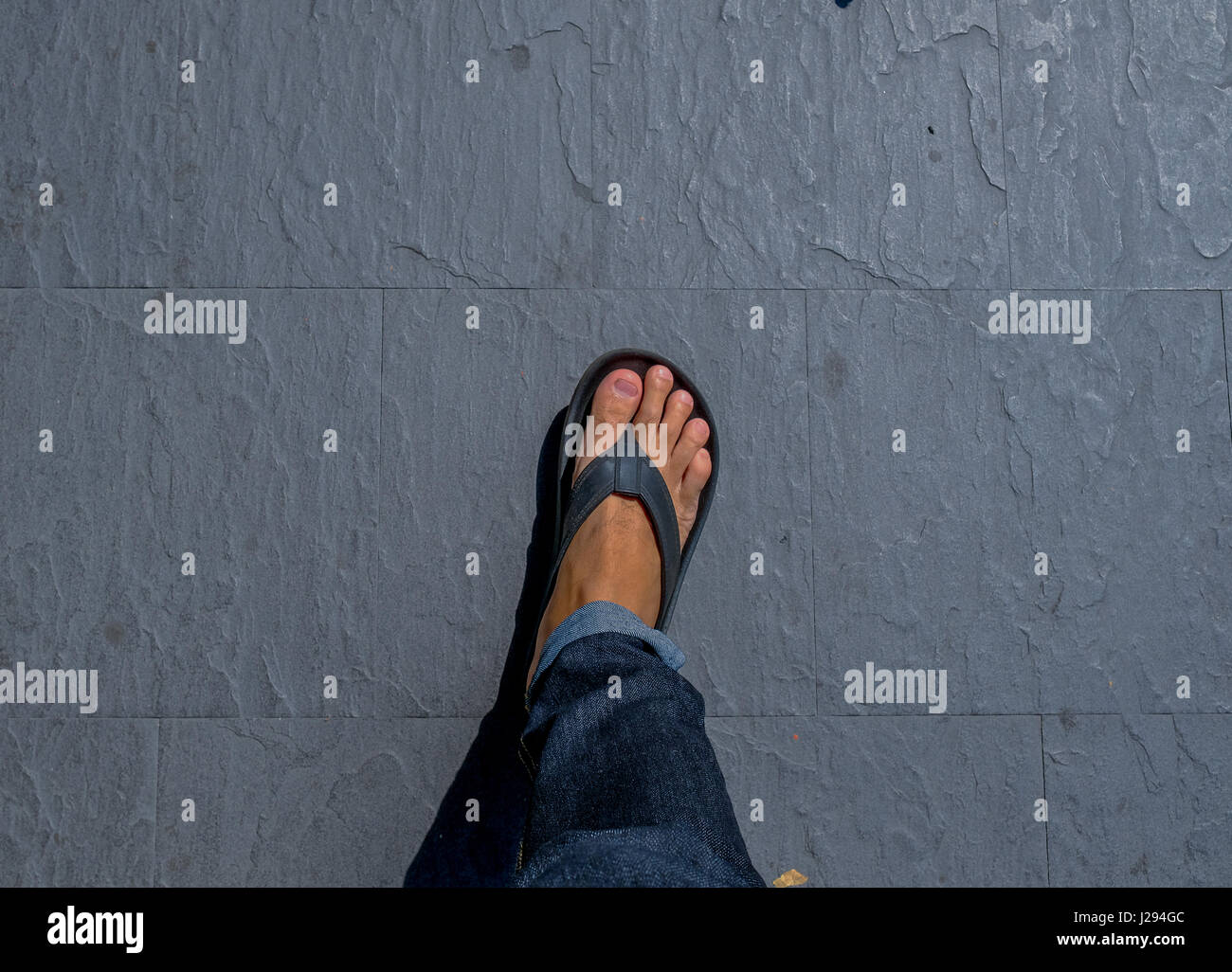 Man feet walking on ground Stock Photo - Alamy