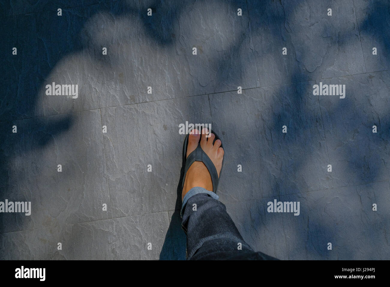 Soft focus Man feet walking on ground Stock Photo - Alamy