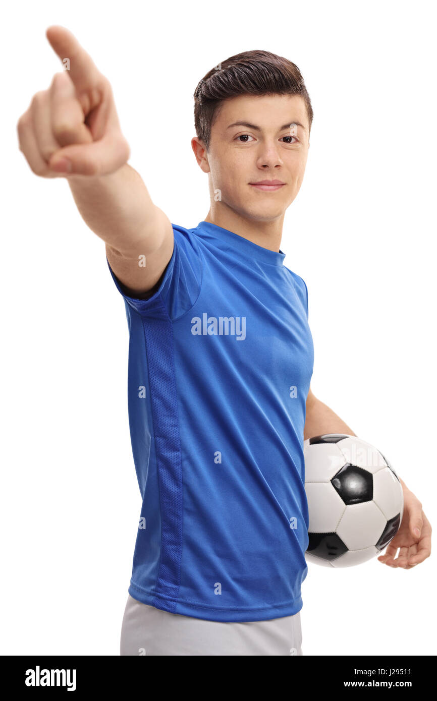Teenage football player pointing with his hand isolated on white ...