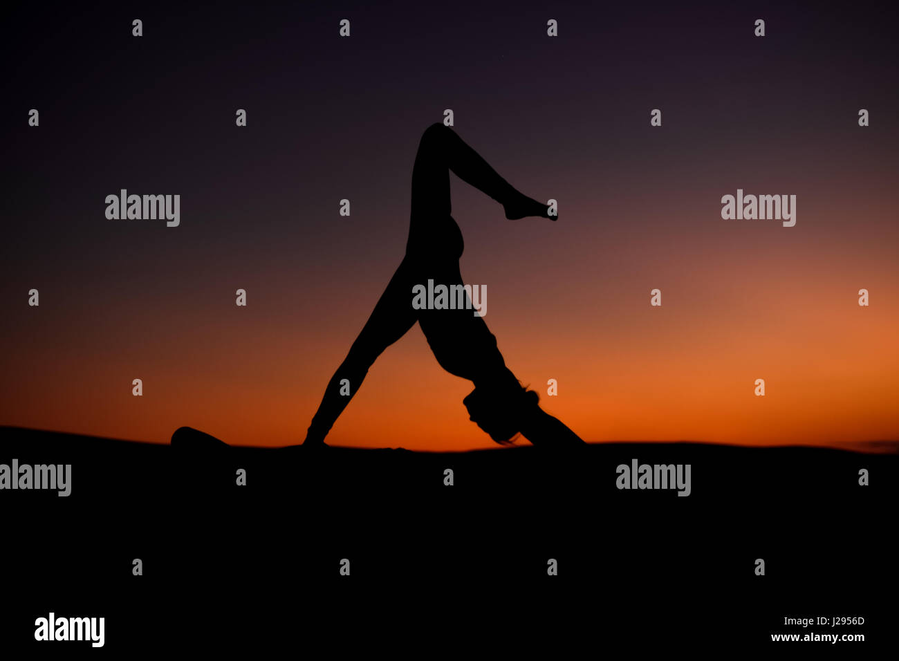 A yogi master is demonstrating her different exercises and poses in ...