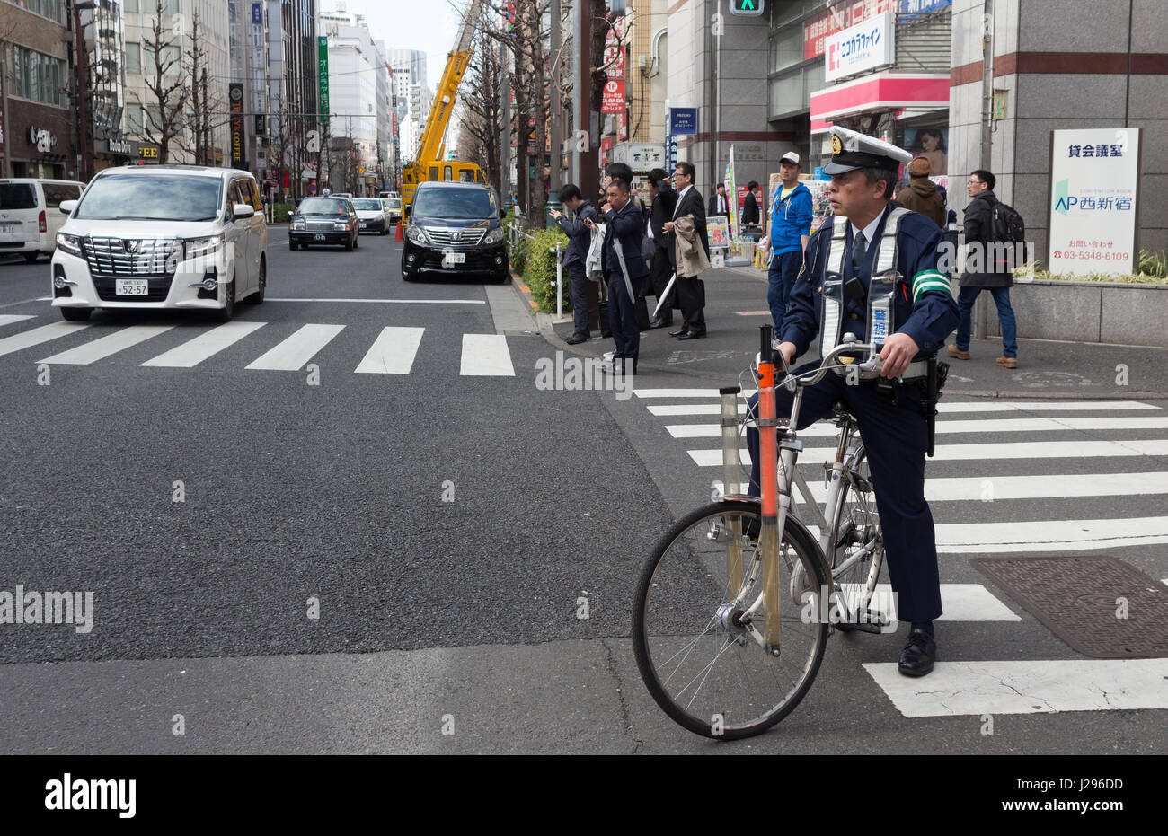 Tokyo, Japan - April 8th, 2017: Japanese police man sitting on a ...