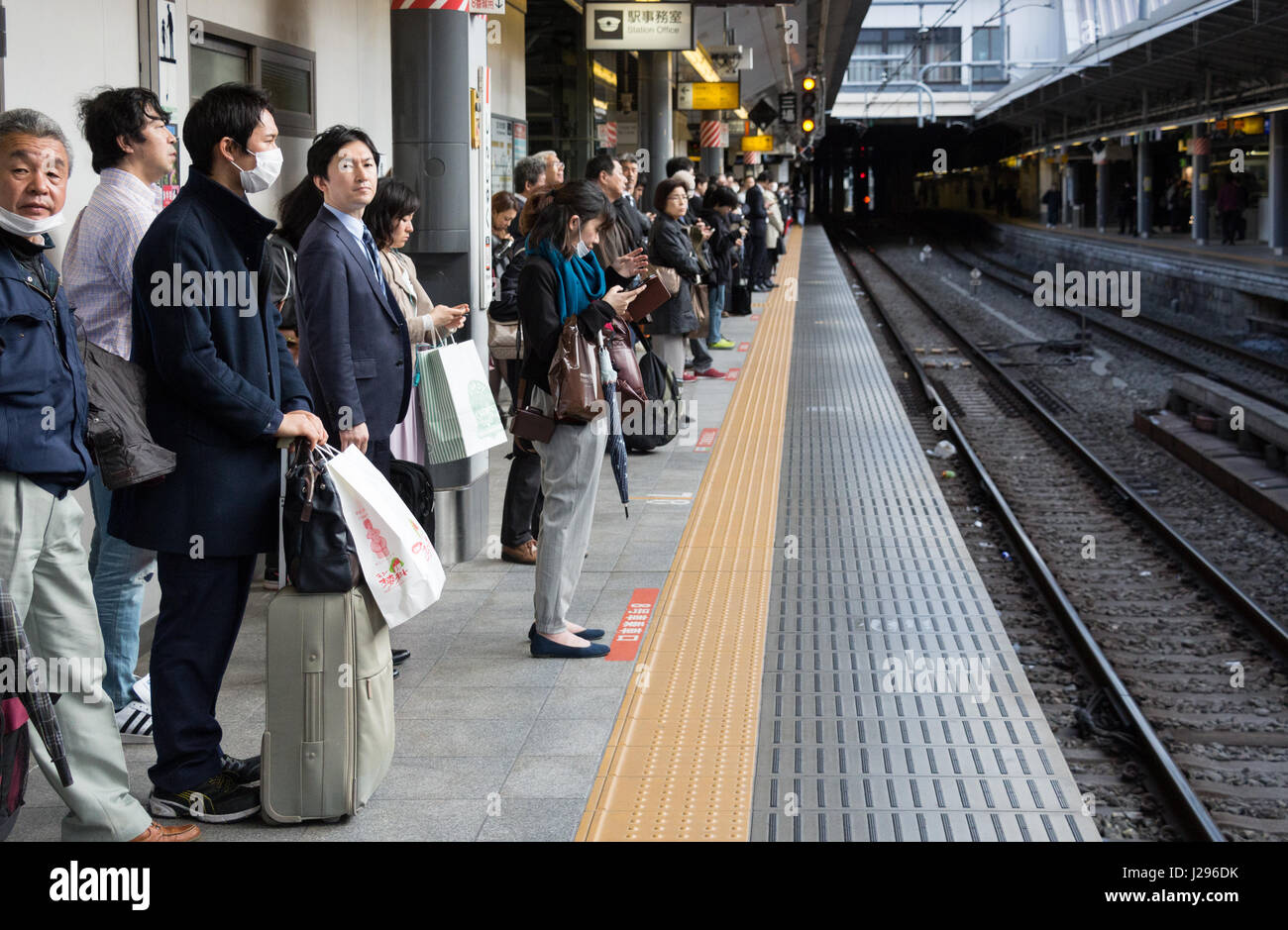 Passengers waiting train japan hi-res stock photography and images - Alamy