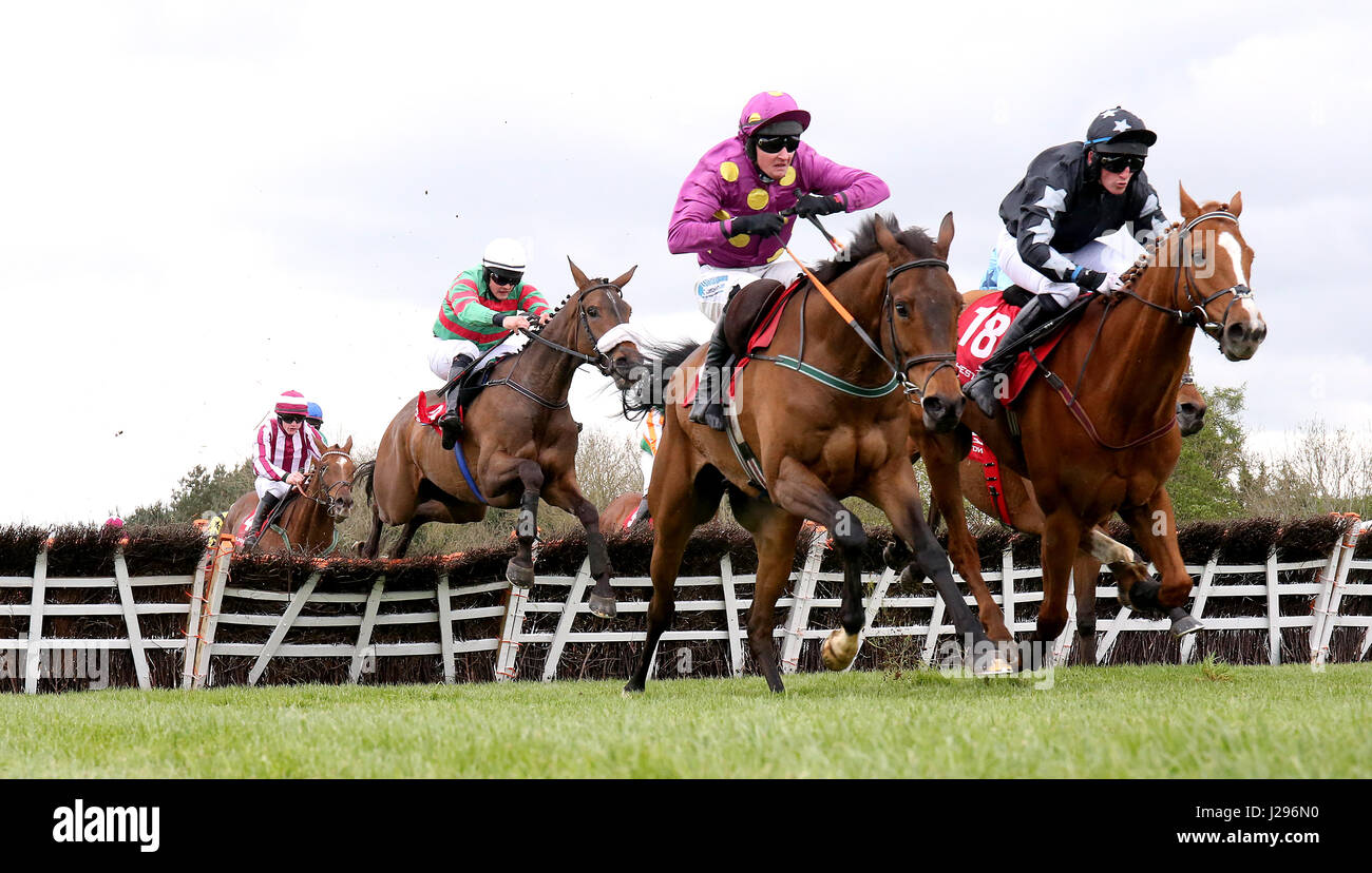 Magic Of Light (second left) ridden by jockey Ryan Treacy jumps the ...