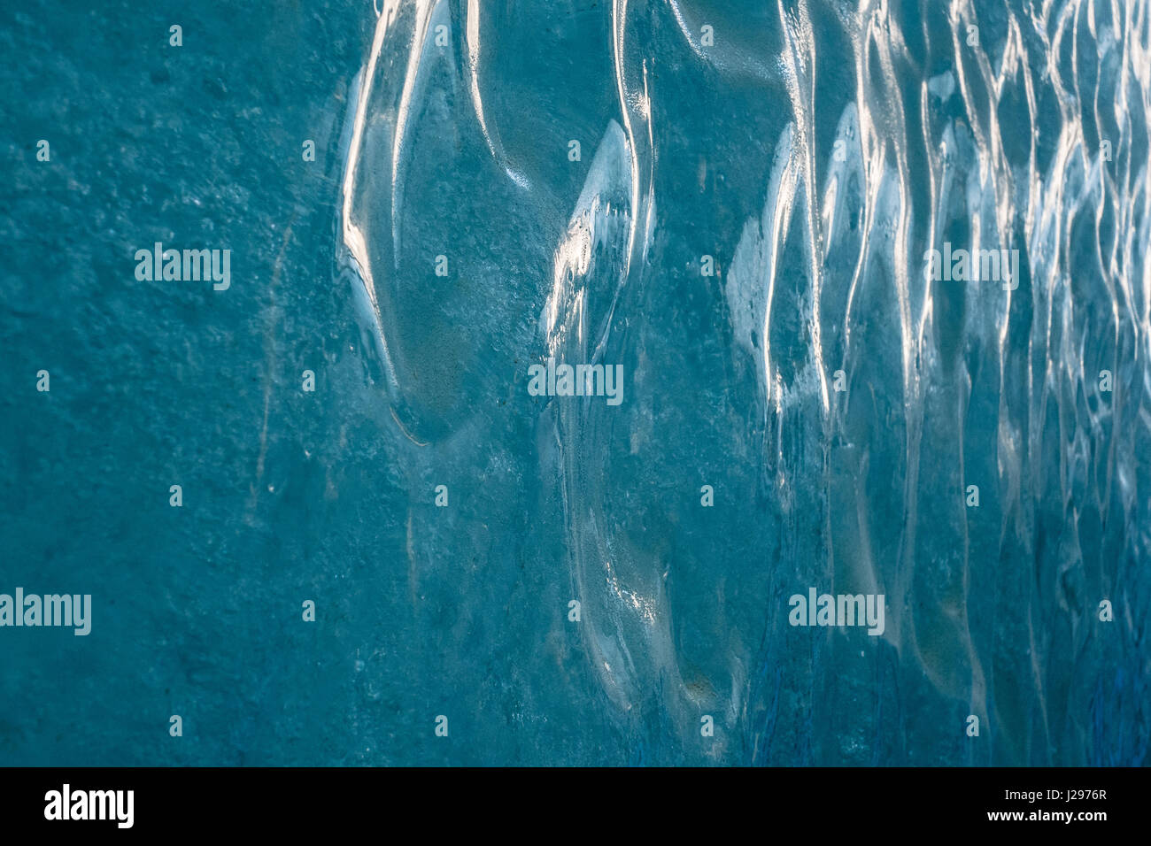 Detail of frozen ice wall in glacier tunnel in Grotte de Glace in the ...