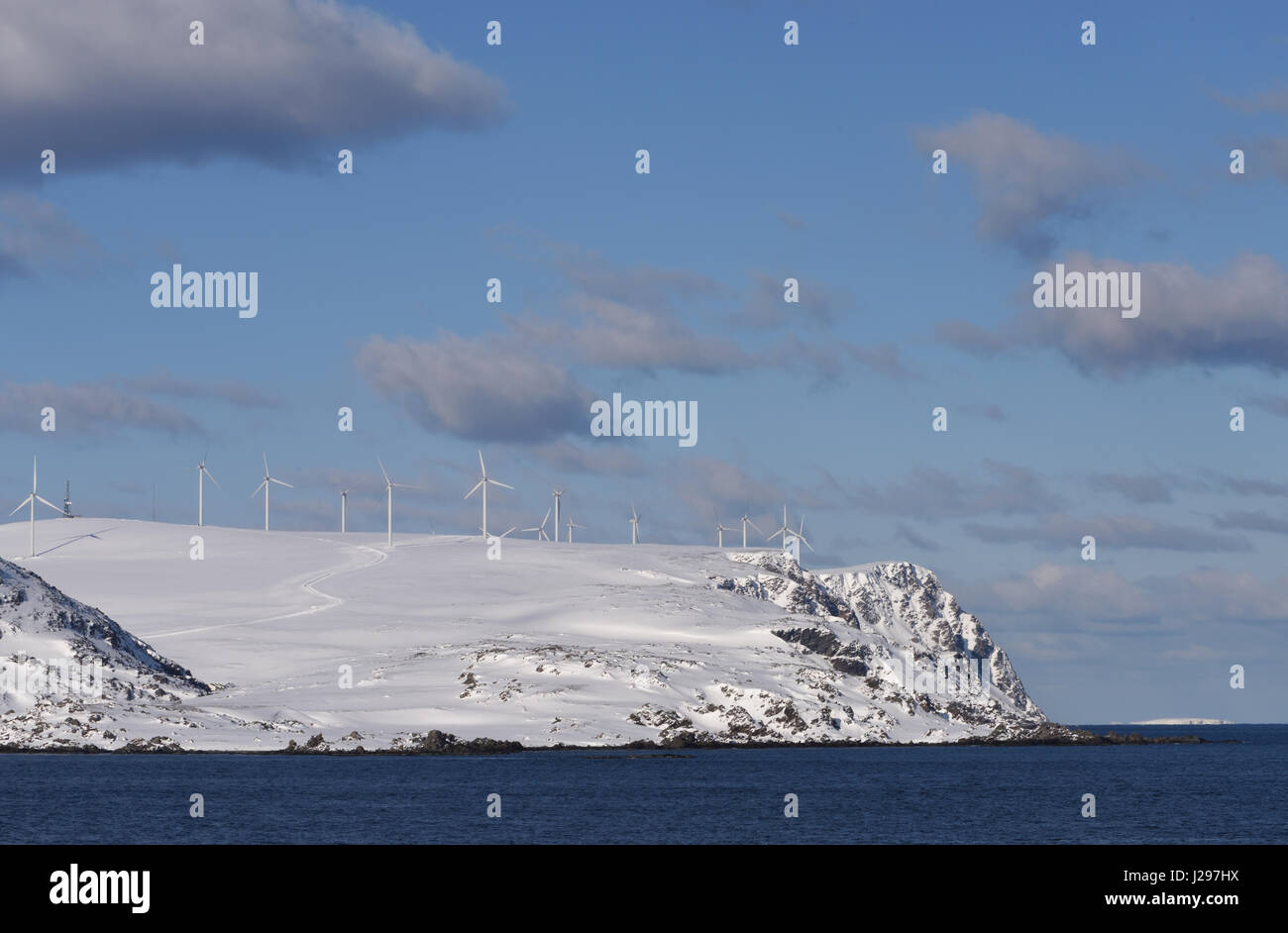 Wind turbines in the Havøygavlen Wind Farm on a hill above Havøysund ...