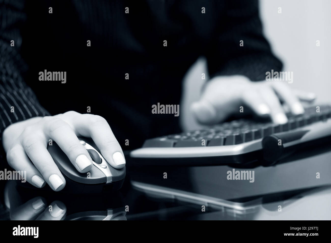 Female hands using computer mouse and keyboard Stock Photo - Alamy