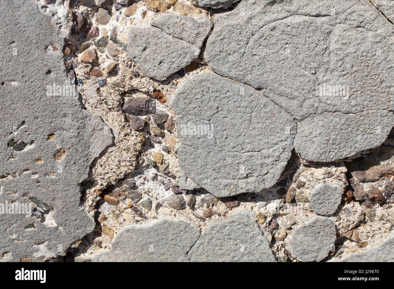 Old worn concrete wall cracking and pitted away Stock Photo - Alamy