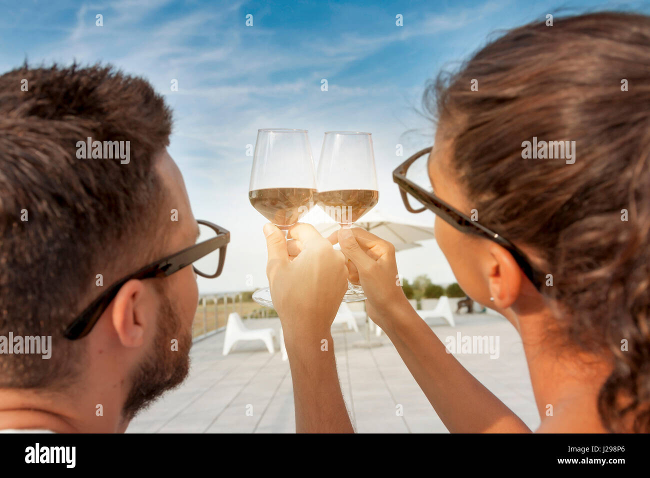 Romantic couple making toast outdoors hi-res stock photography and ...