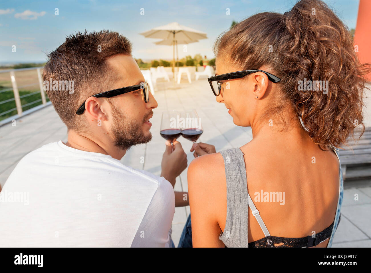 Romantic couple making toast outdoors hi-res stock photography and ...
